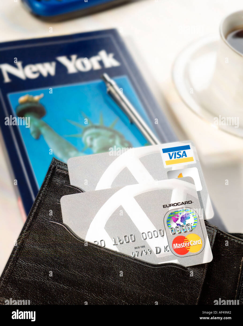 Credit cards in wallet on guide book for New York Stock Photo - Alamy