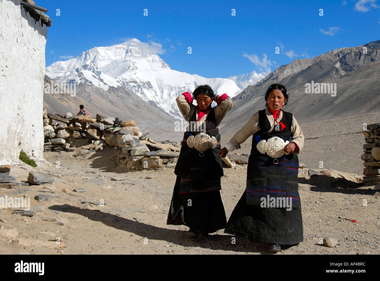 Two Tibetan pilgrims women in front of Mt Everest Chomolungma Rongbuk ...