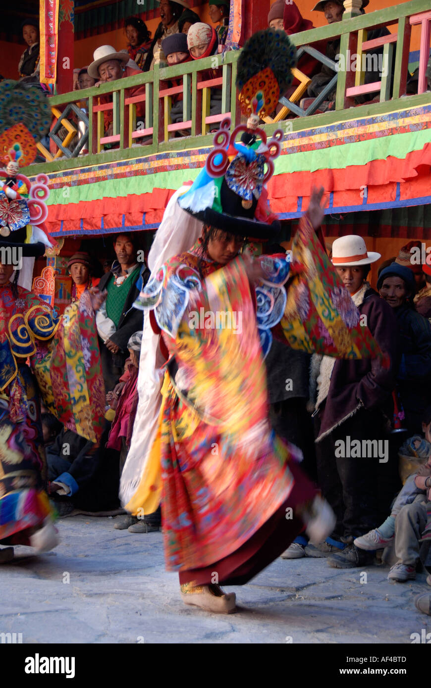 Blurred motion monk dances with fearful and mask and dress of a demon ...