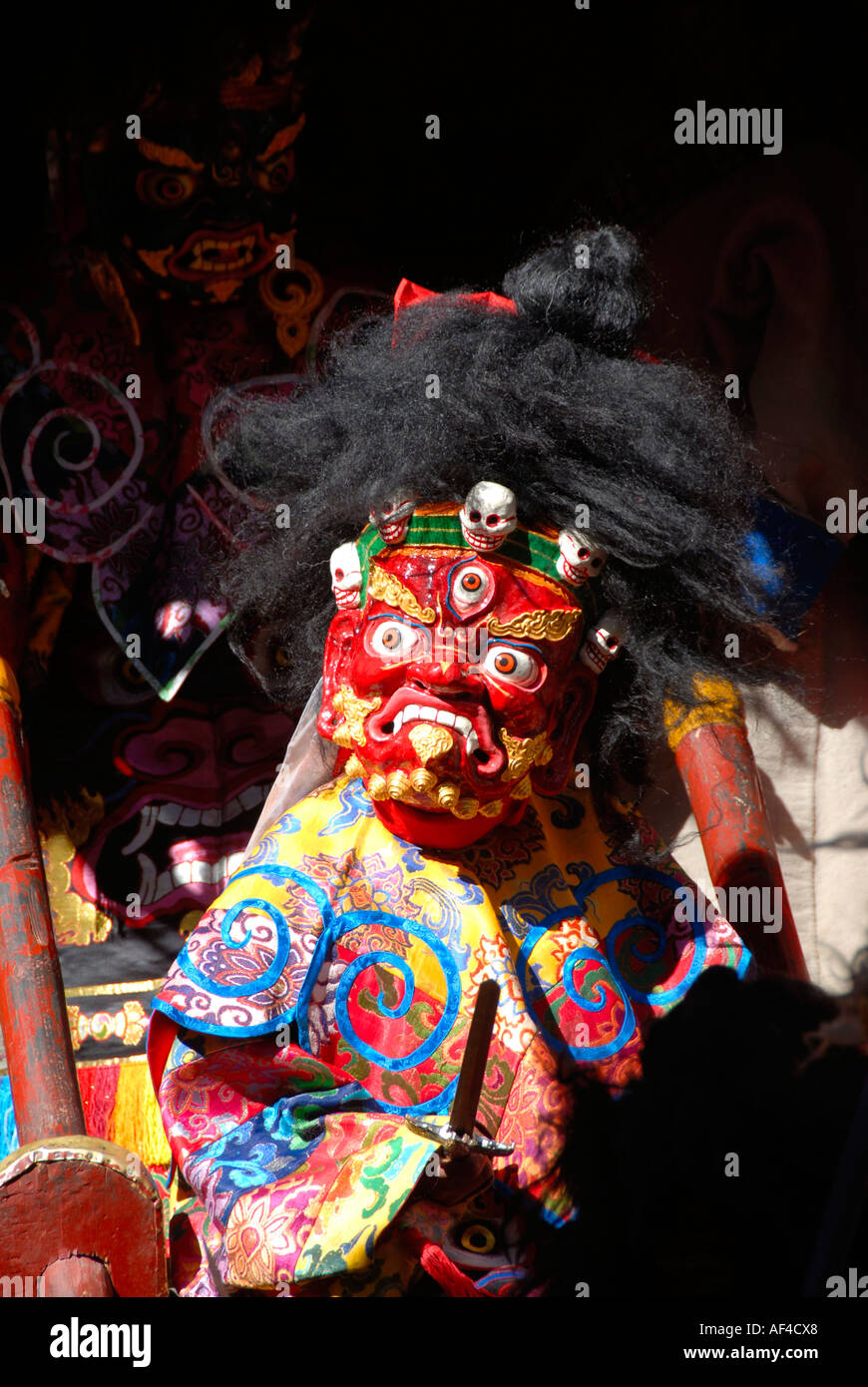 Monk wears fearful red mask hi-res stock photography and images - Alamy