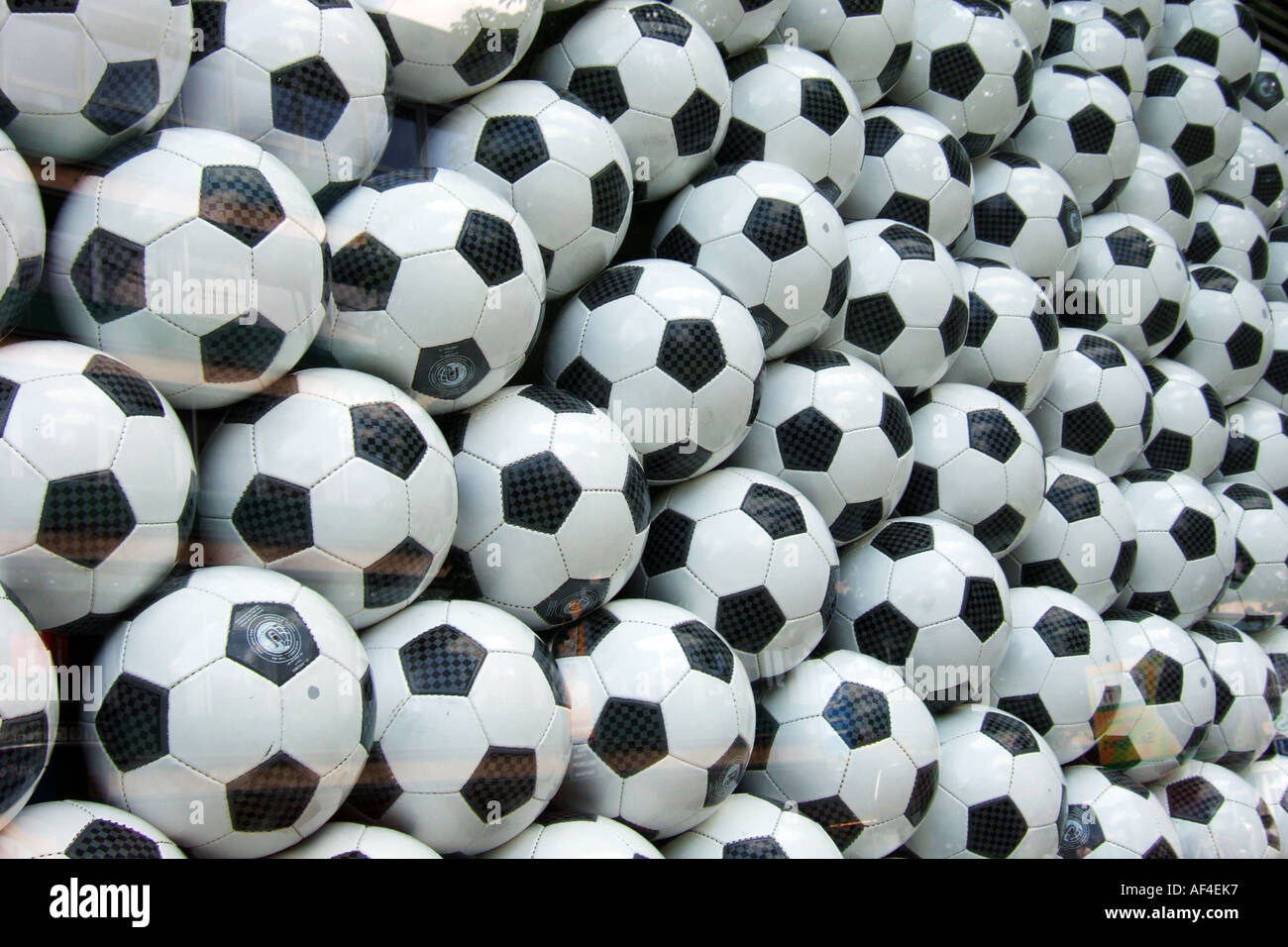 display window full of footballs Stock Photo - Alamy