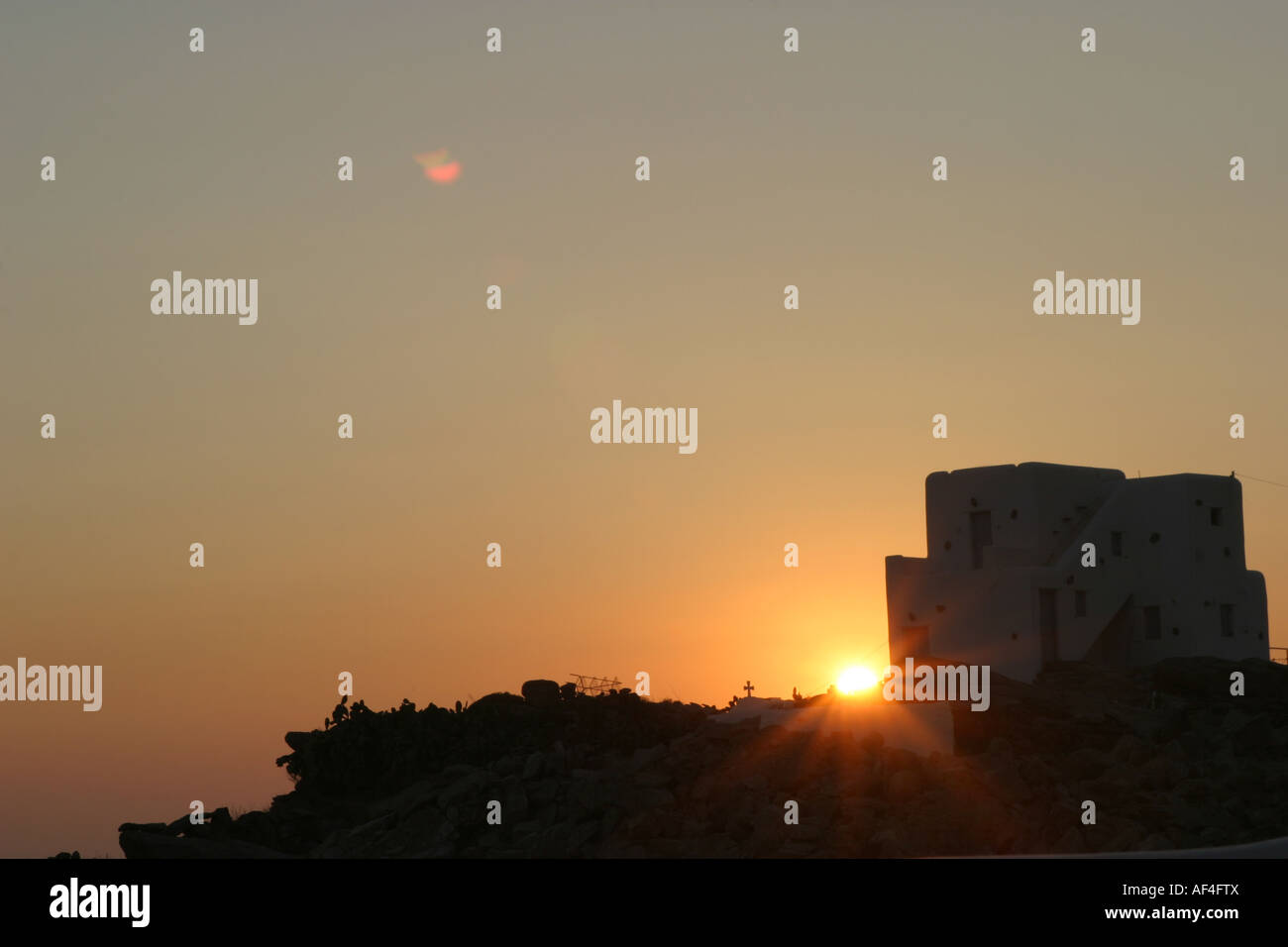 View of Greek white building and grave at sunset Stock Photo - Alamy