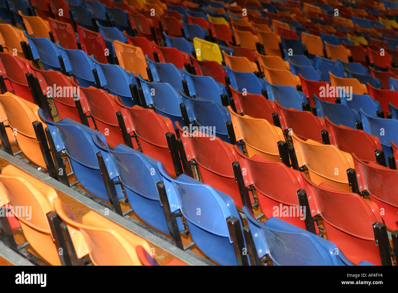 Horizontal Seating accommodation in a large auditorium. Red, yellow ...
