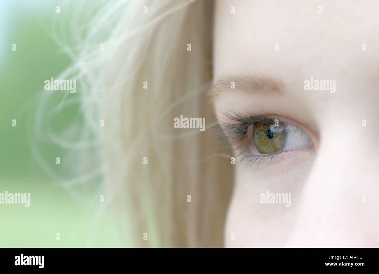 Beautiful Caucasian blond woman one eye only Stock Photo - Alamy