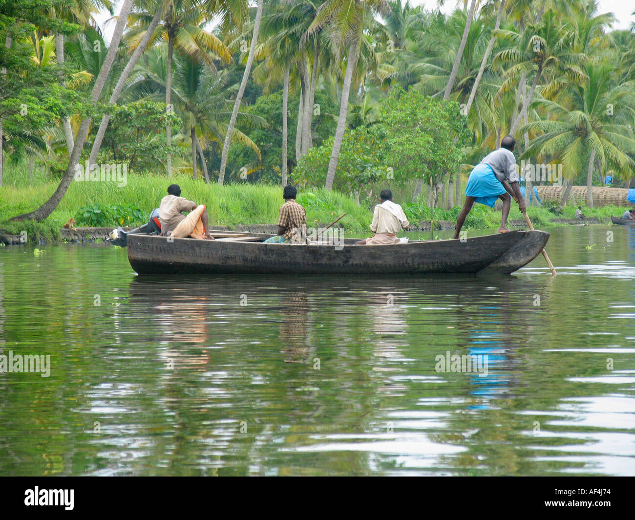 Landscape—Small boats for the general transport in backwaters of Kerala ...
