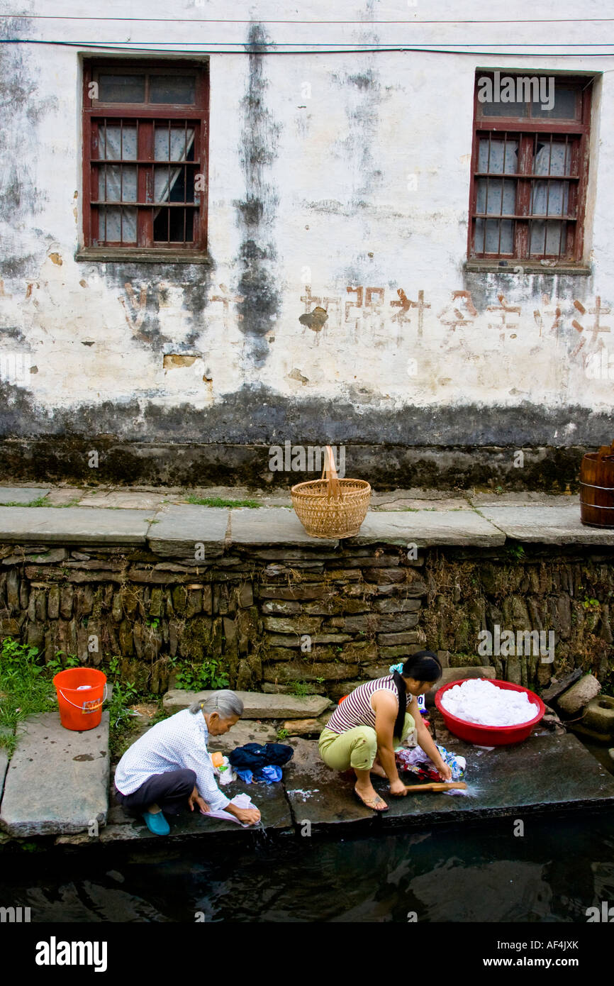 Women hand washing in stream hi-res stock photography and images - Alamy