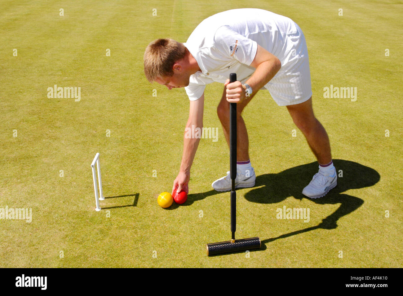 Man playing croquet at Cheltenham Croquet Club Gloucestershire England ...
