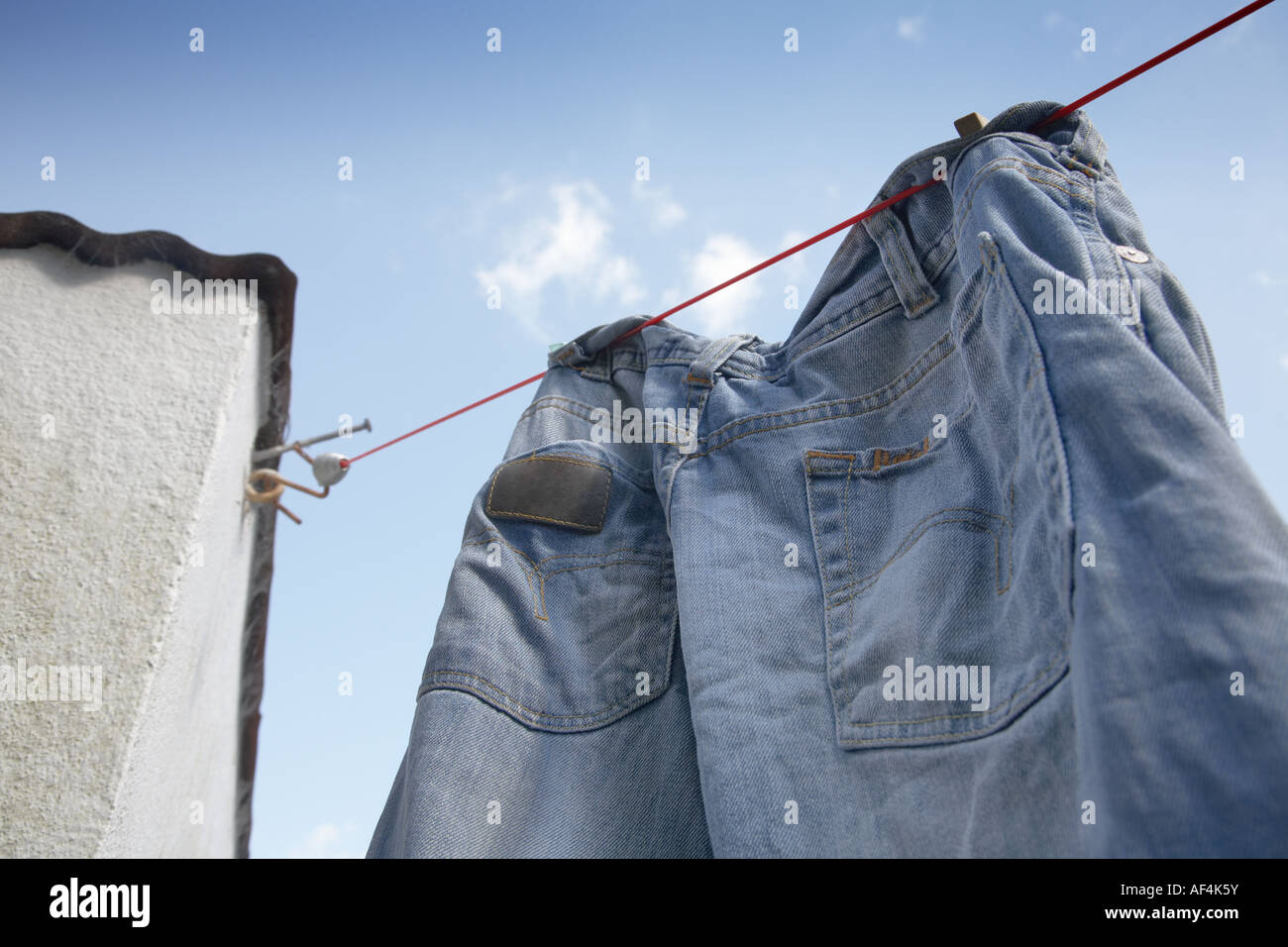 Jeans drying on a washing line Stock Photo - Alamy