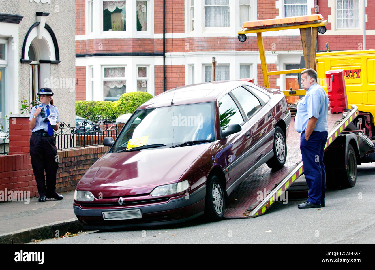 Untaxed car being taken away on a low loader in a DVLA operation on ...