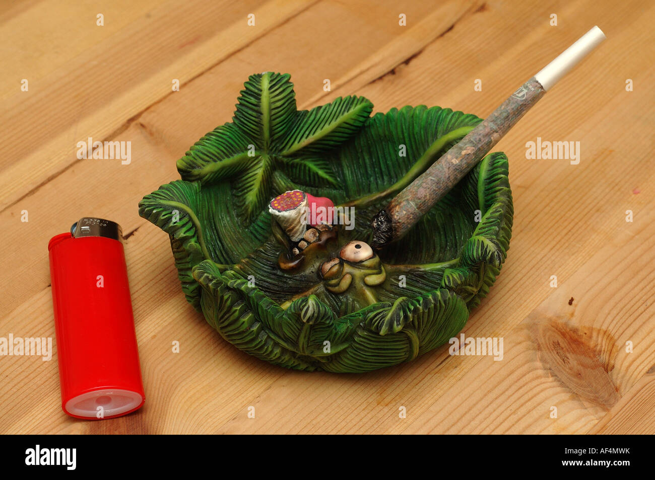 Cannabis Cigarette and Red Lighter Stock Photo - Alamy