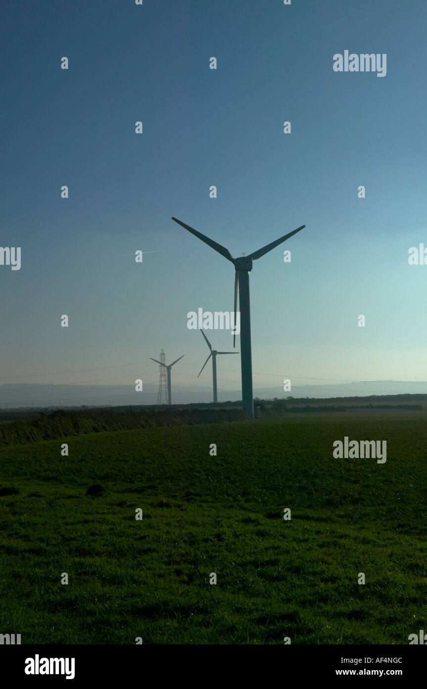 Wind farm with electricity pylons Stock Photo - Alamy