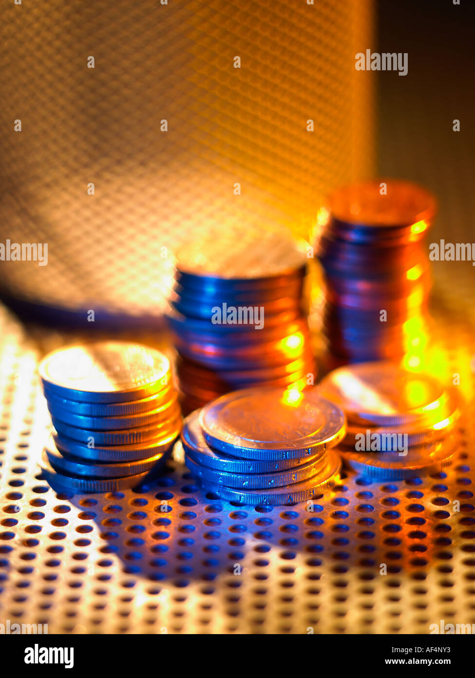 piles of money balancing Stock Photo - Alamy