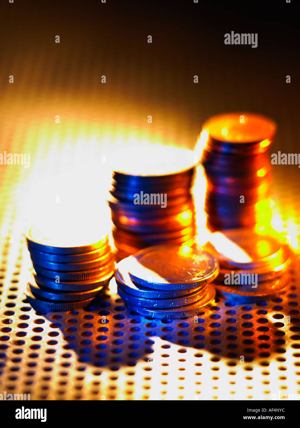 piles of money balancing Stock Photo - Alamy