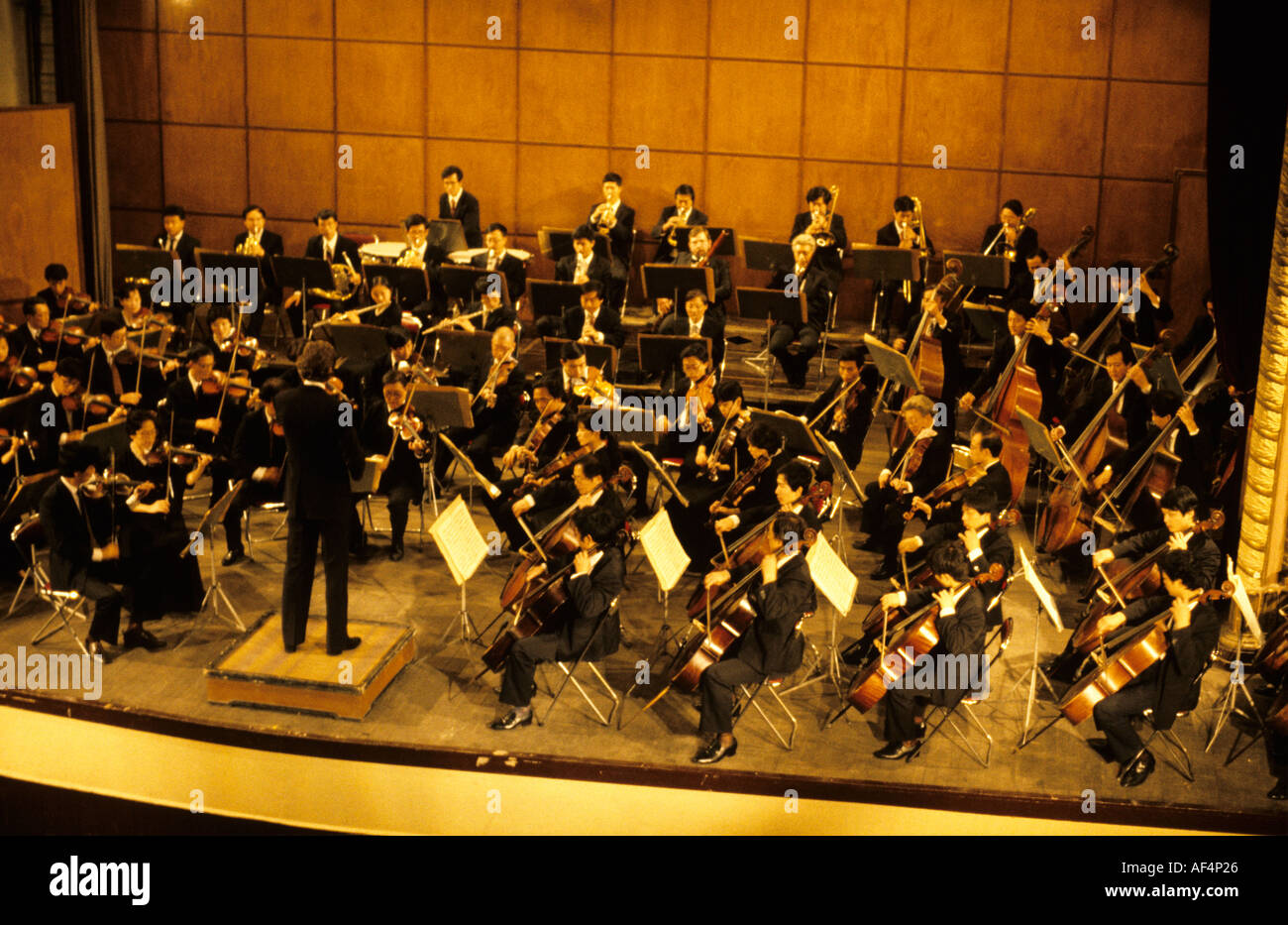 The Shanghai Symphony Orchestra and their conductor playing in Shanghai ...