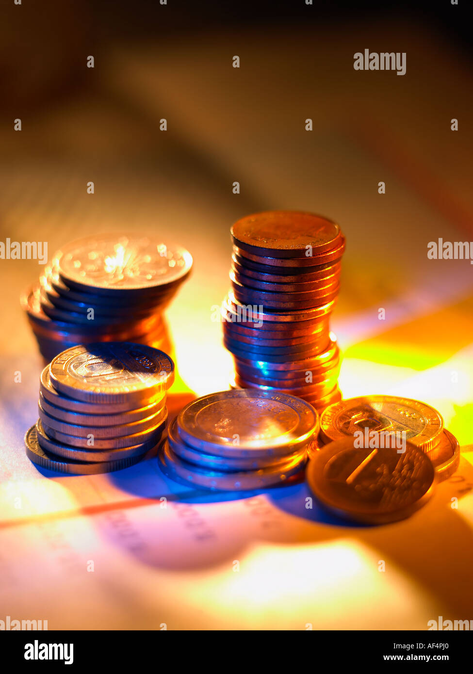 piles of money balancing Stock Photo - Alamy