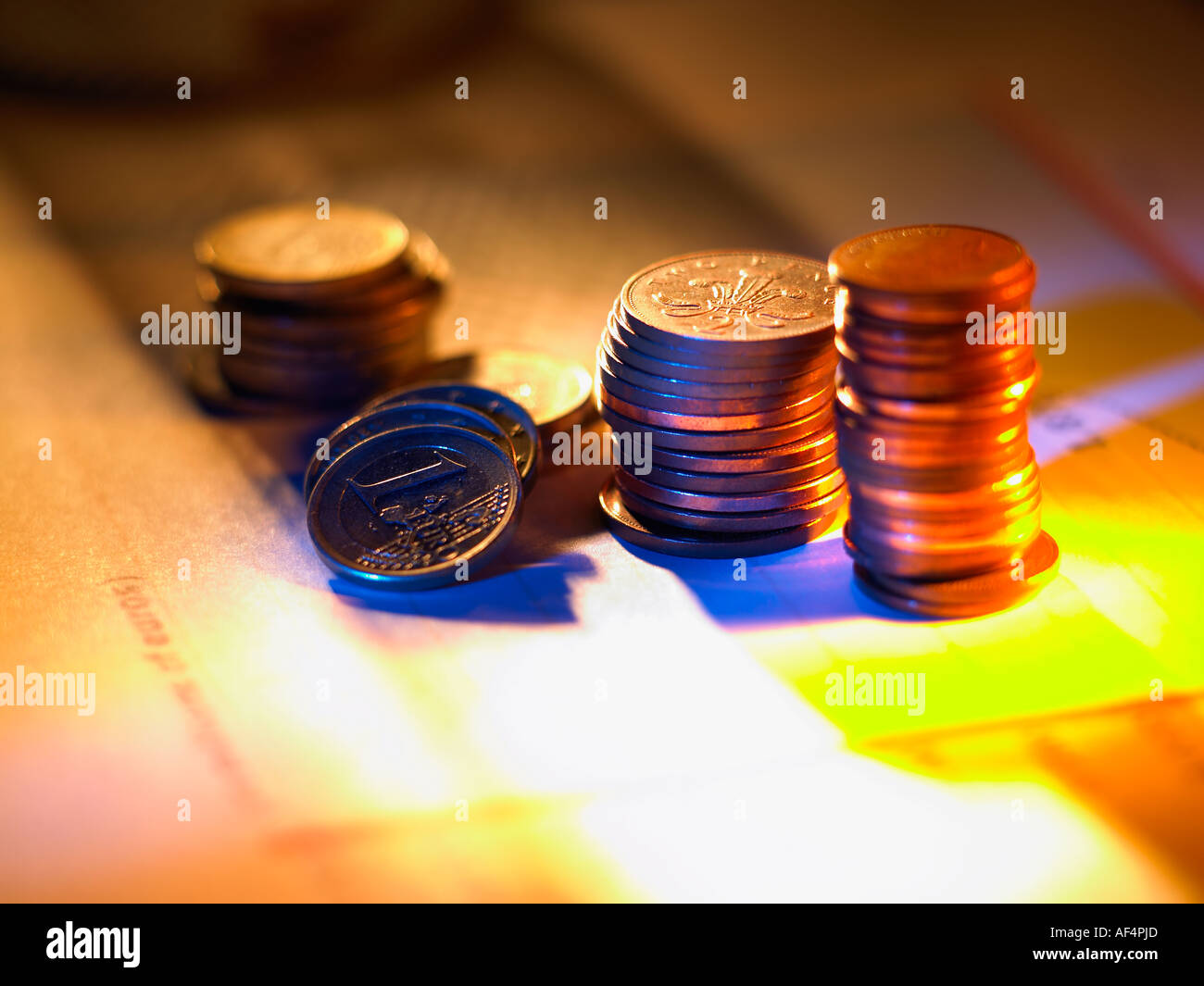 piles of money balancing Stock Photo - Alamy