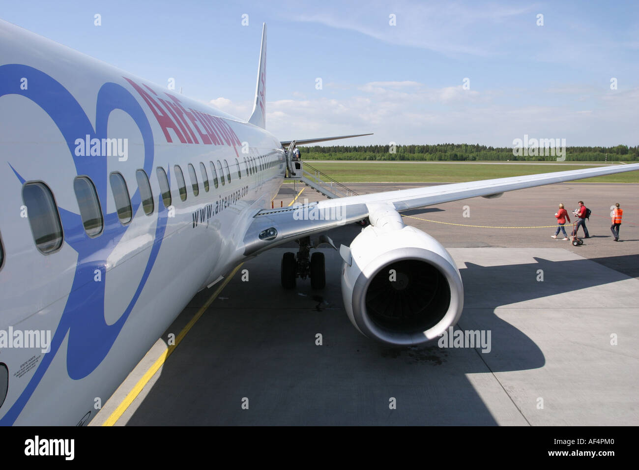 Passengers entering an airplane on an airport Stock Photo - Alamy