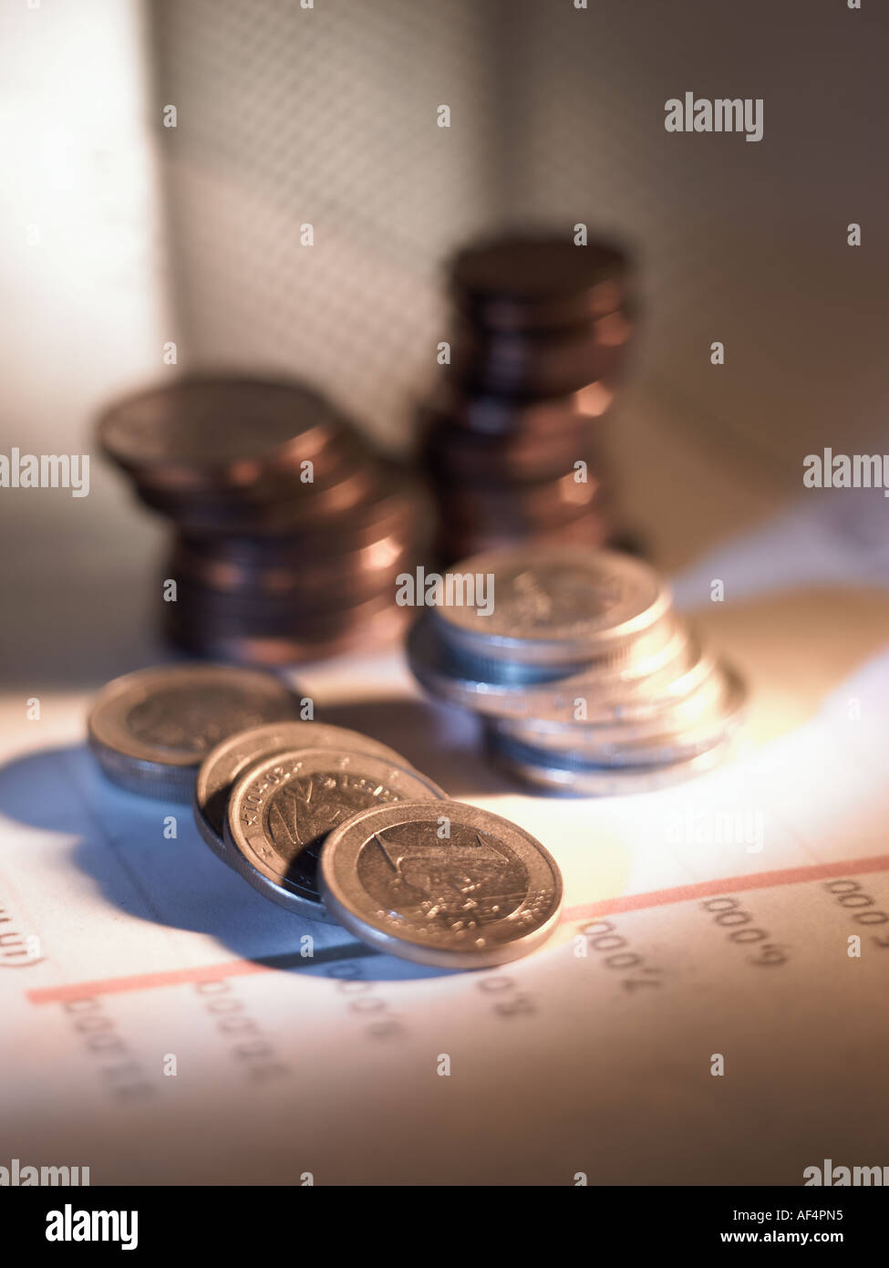 piles of money balancing Stock Photo - Alamy