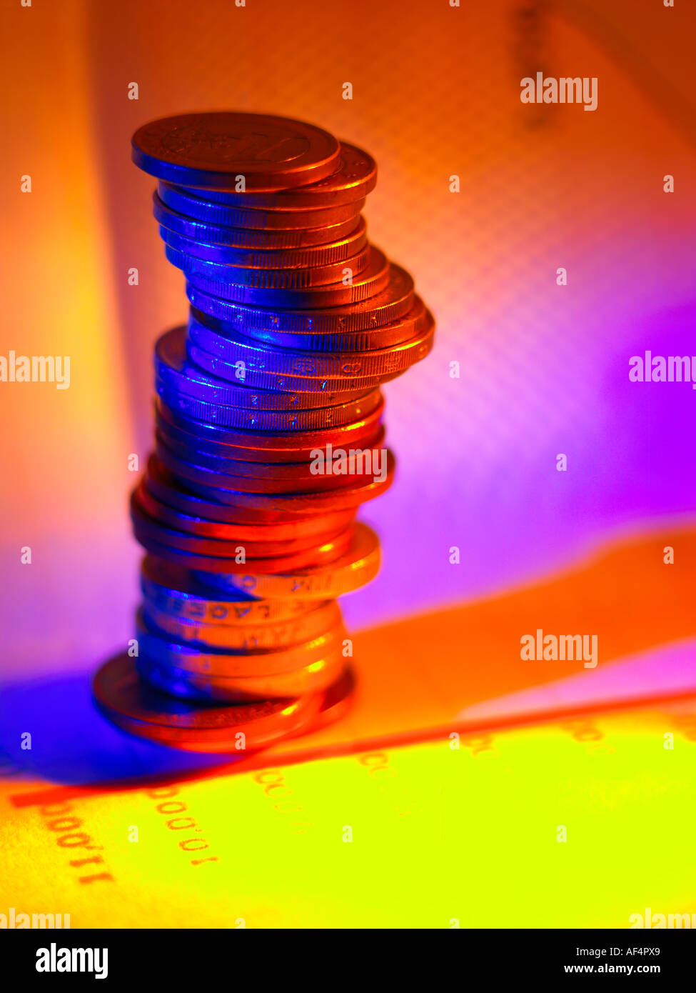 piles of money balancing Stock Photo - Alamy