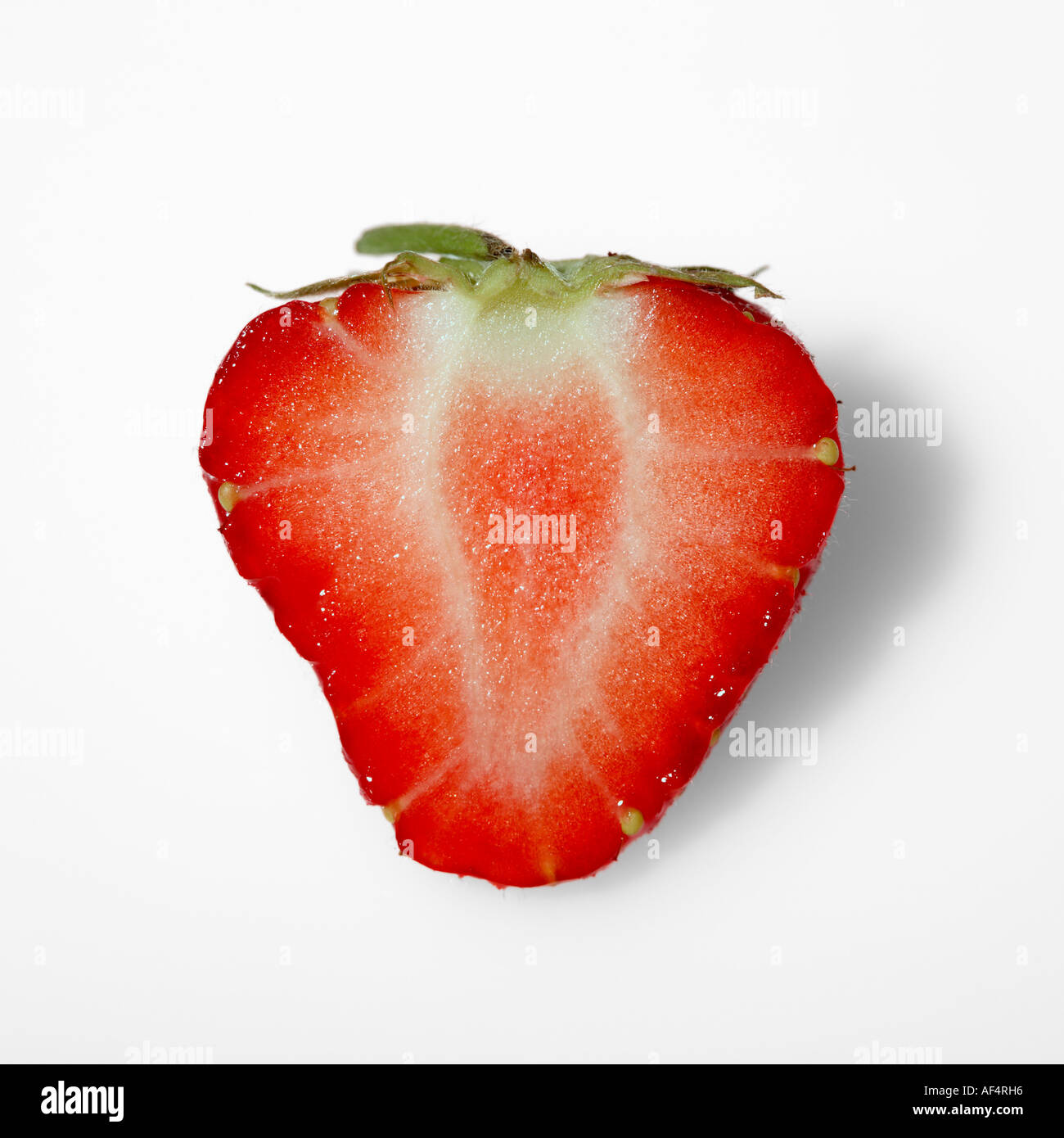 Halved strawberry on white background, half, halve, cross section Stock ...