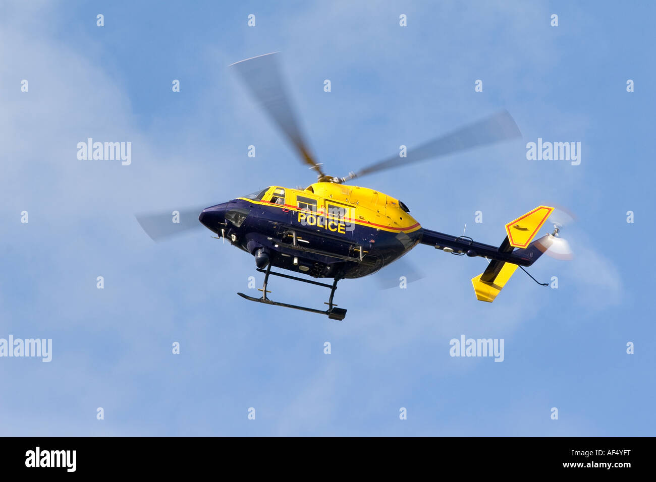 A police helicopter flying with a blue sky in the background Stock ...