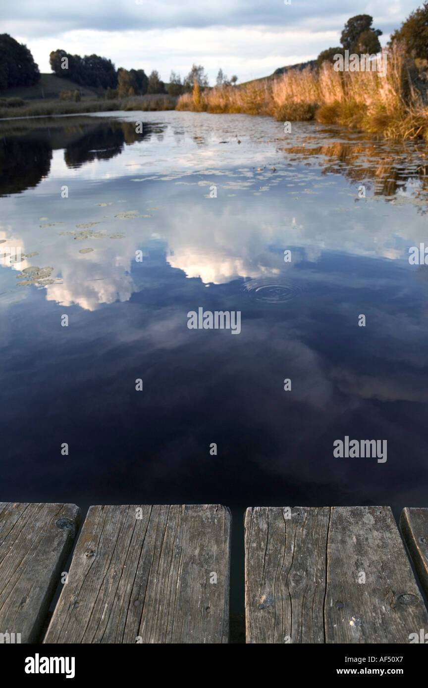Reflection of clouds in water Stock Photo - Alamy