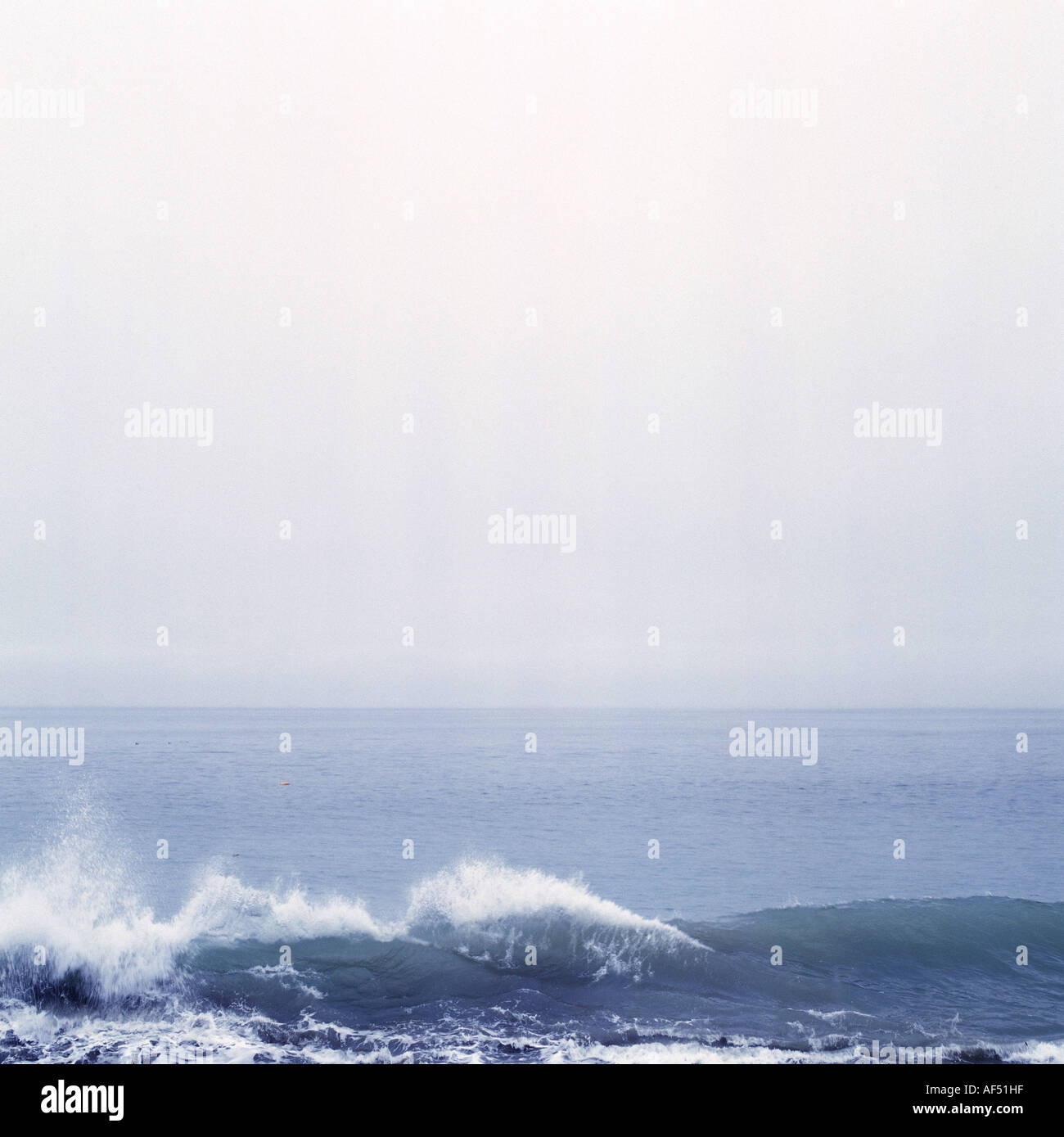 Waves breaking on rocks Stock Photo - Alamy