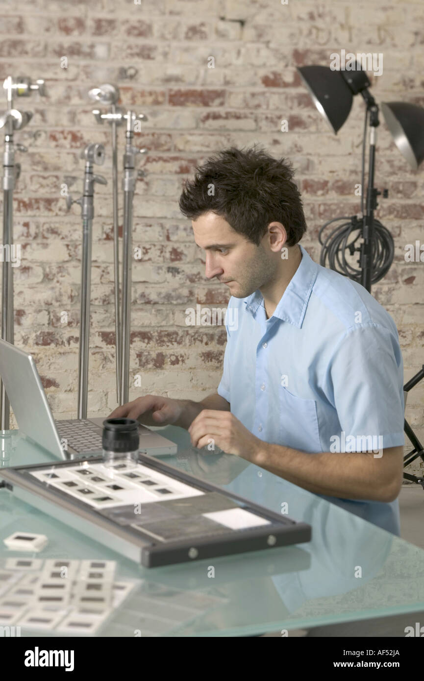 Side profile of a young man using a laptop Stock Photo - Alamy
