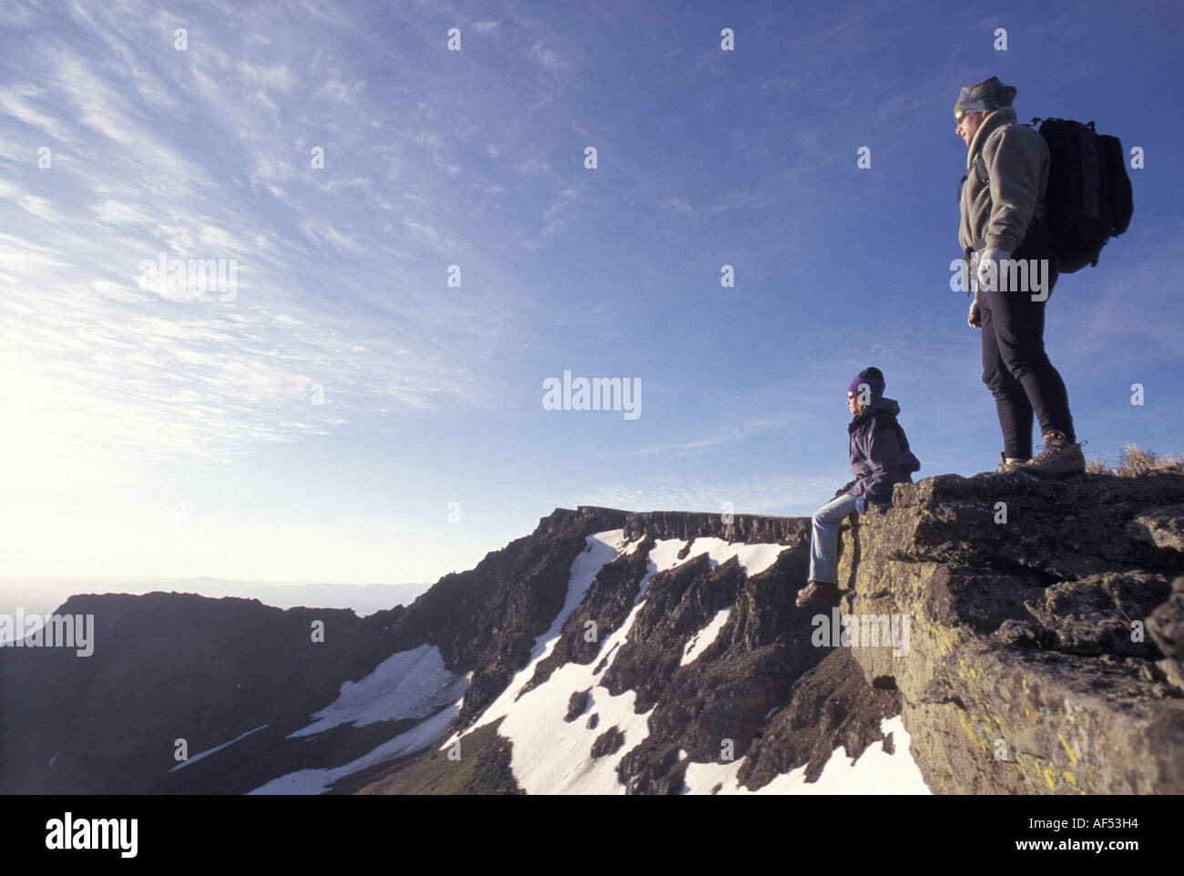 Side profile of two people on the hill Stock Photo - Alamy
