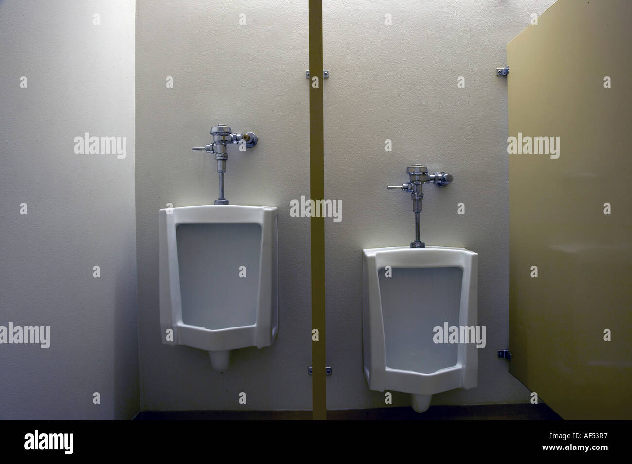 Two urinals in a restroom Stock Photo - Alamy
