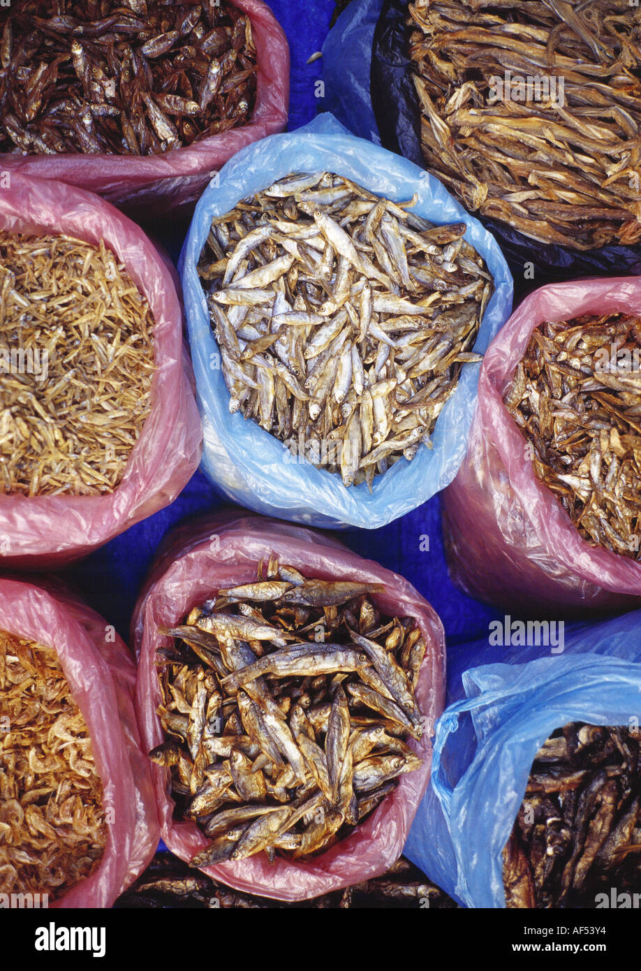 High angle view of dried fish in sacks Stock Photo - Alamy