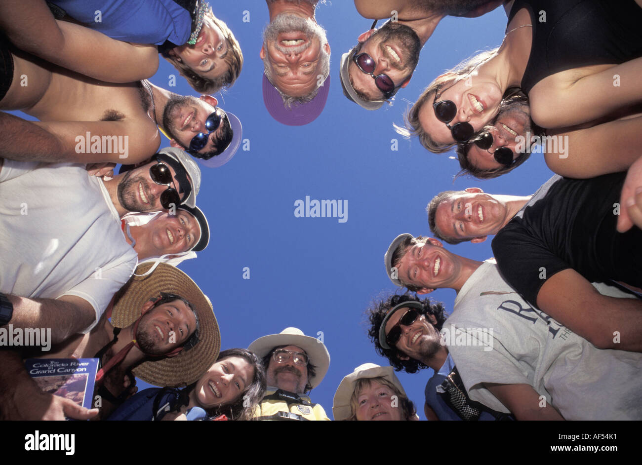 Low angle view of a group of people standing in a circle Stock Photo ...