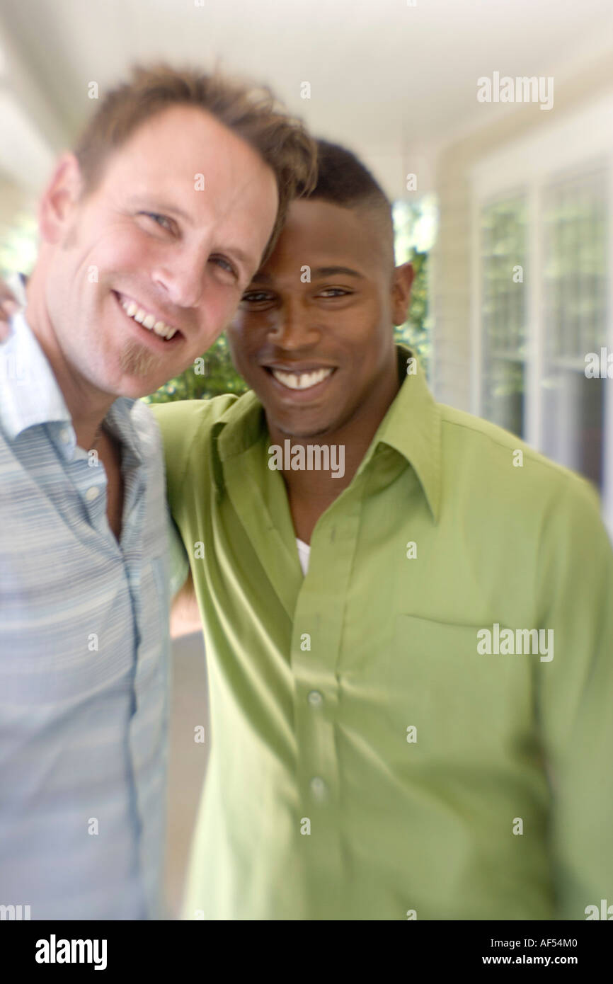 Down men smiling two hi-res stock photography and images - Alamy