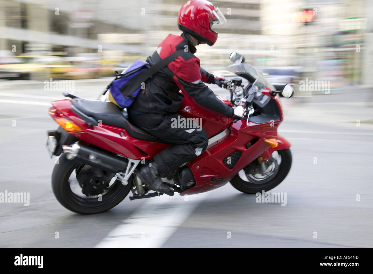 Side profile of a man riding a motorcycle Stock Photo - Alamy