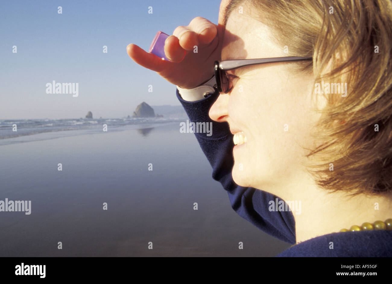 Side profile of a young woman smiling Stock Photo - Alamy