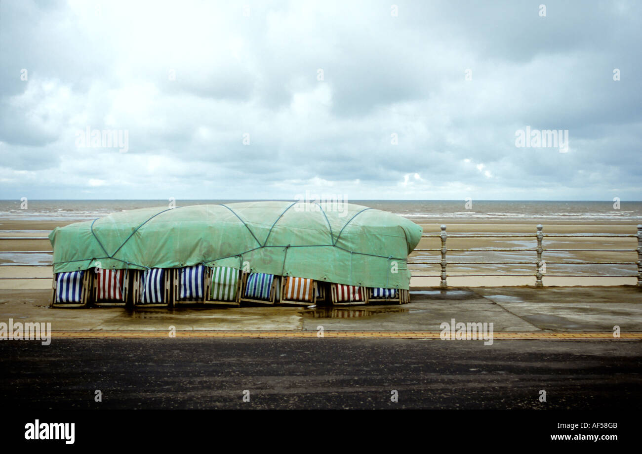 Beach chairs covered during rain. Blackpool beachfront England Stock ...