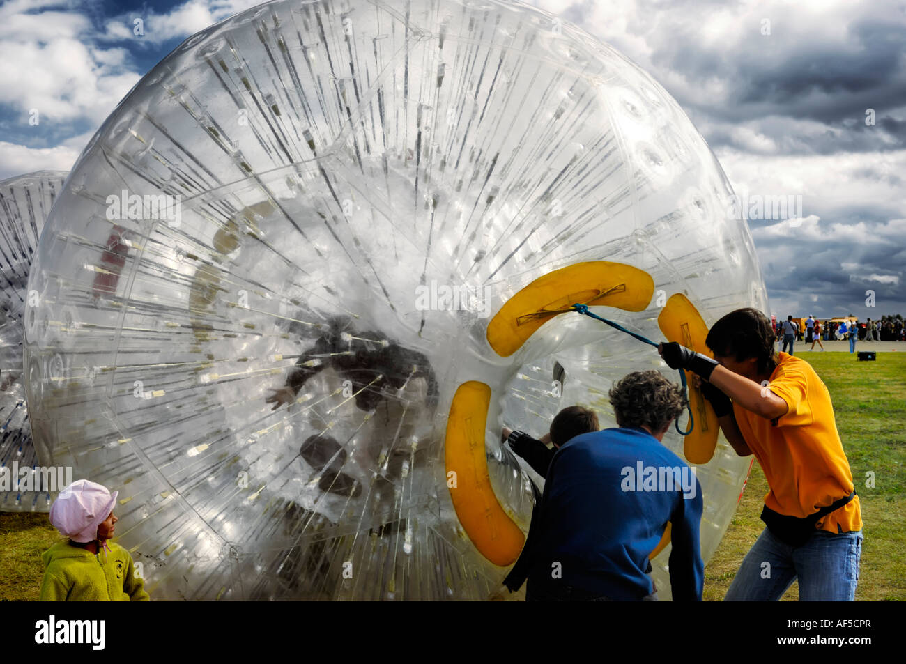 Child entering Twelve feet inflatable sphere Stock Photo - Alamy