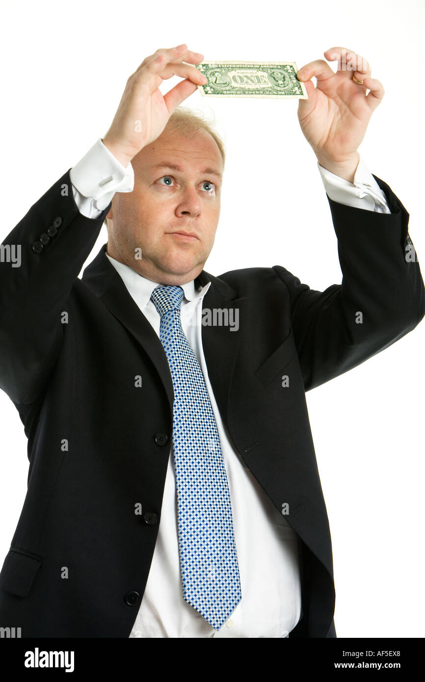 Man holding a dollar bill to the light Stock Photo - Alamy