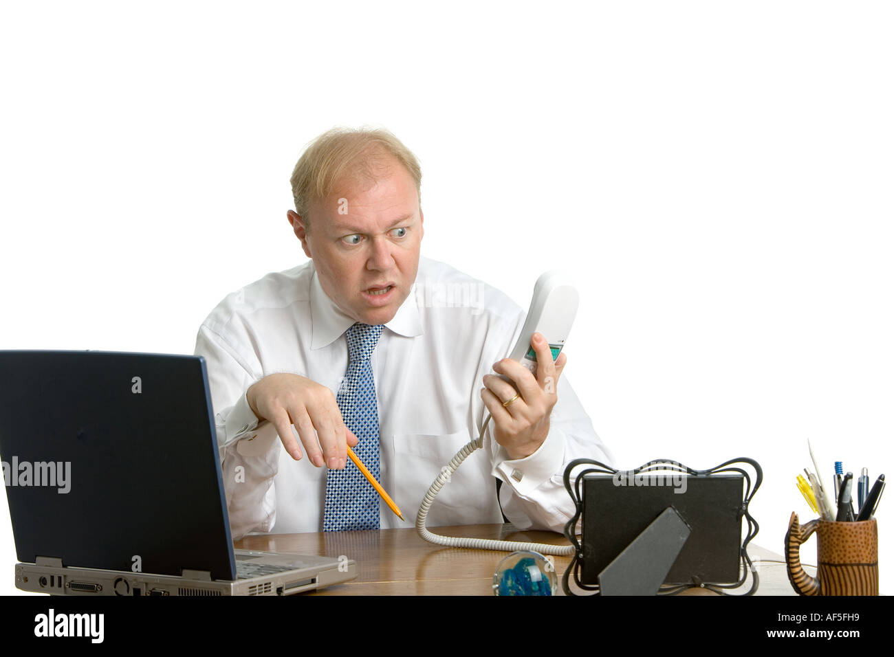 Outraged executive at his desk Stock Photo - Alamy