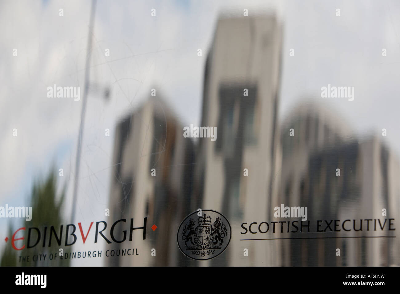 Scottish Parliament building reflected in the stainless steel signage ...