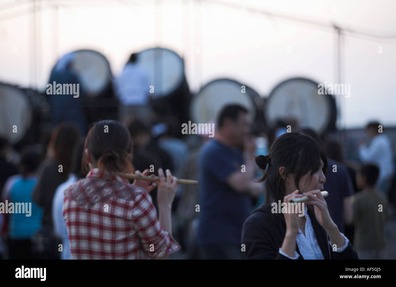 Playing flute street crowd hi-res stock photography and images - Alamy