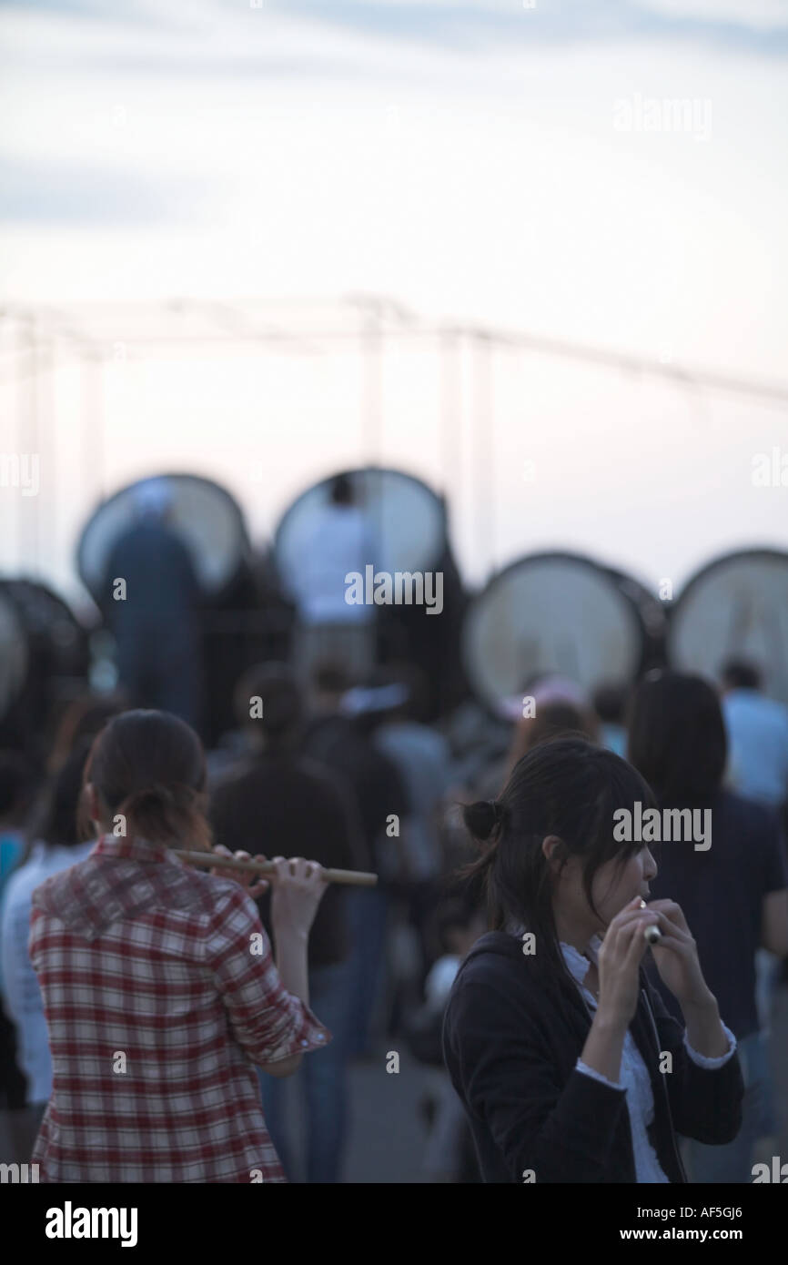 Playing flute street crowd hi-res stock photography and images - Alamy