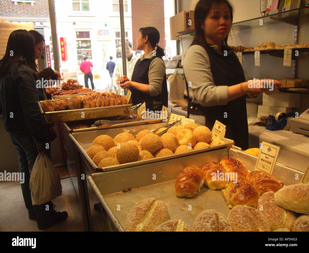 Women serving Chinese bakery Chinatown Soho London England Stock Photo ...