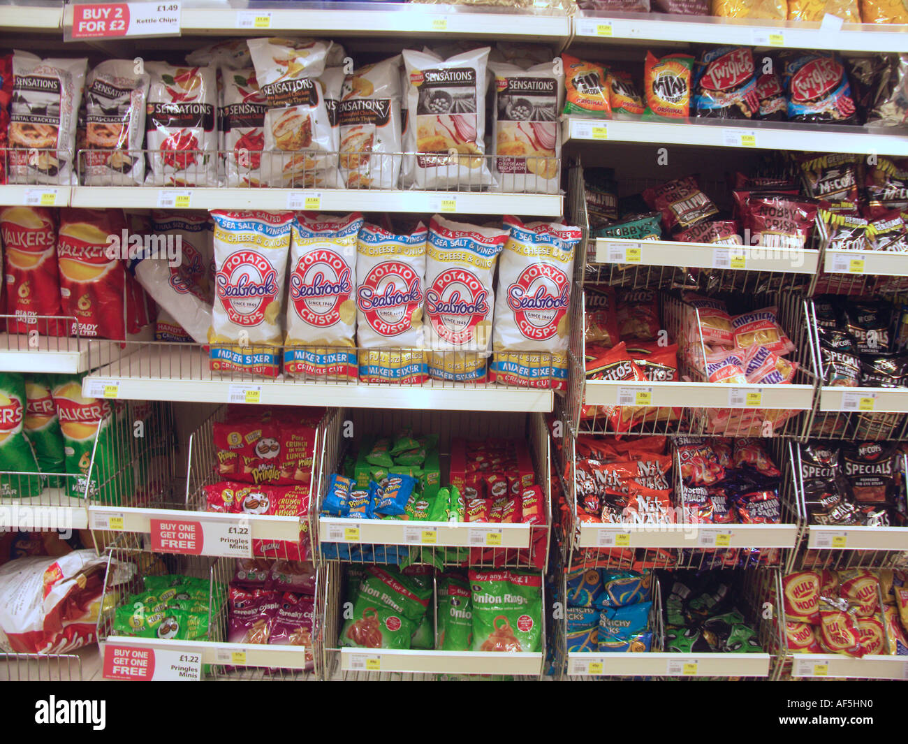 Potato crisp snacks in shelves on display in a supermarket shop Stock ...