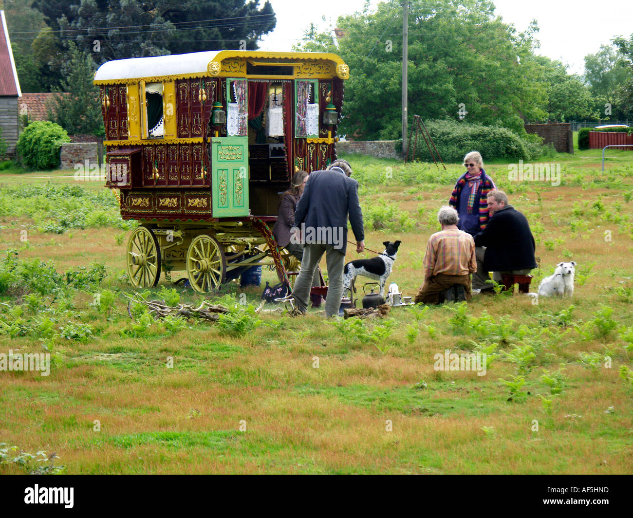 Old gypsy caravan and people on a common in Suffolk England Stock Photo ...