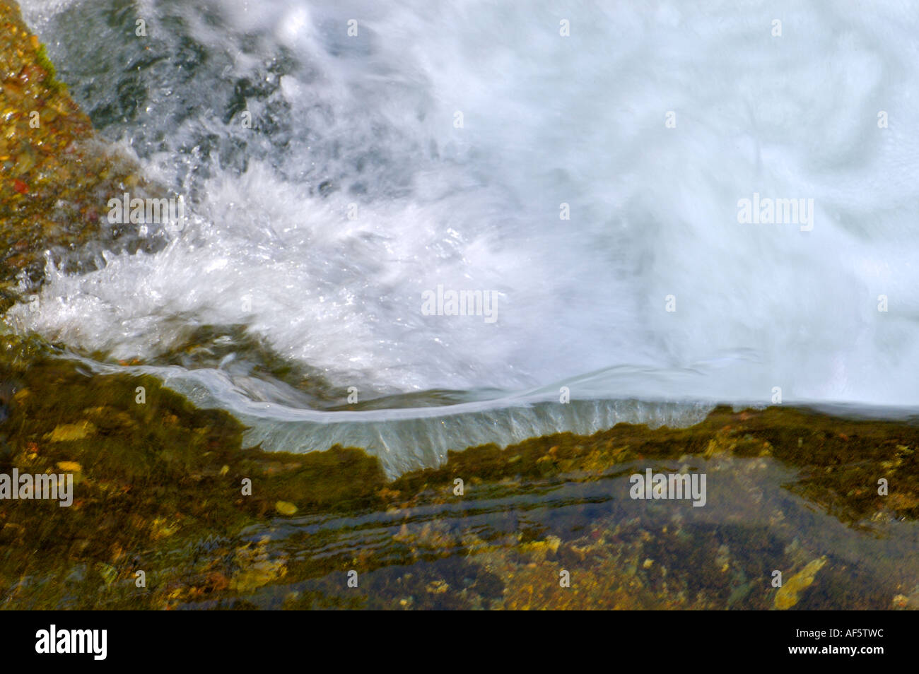 Water flowing over rocks Stock Photo - Alamy