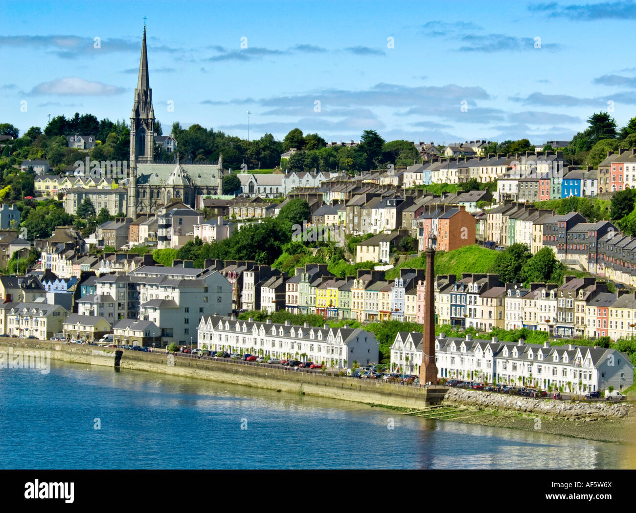 The cathedral towers above the harbour at Cobh Cove in the Republic of ...