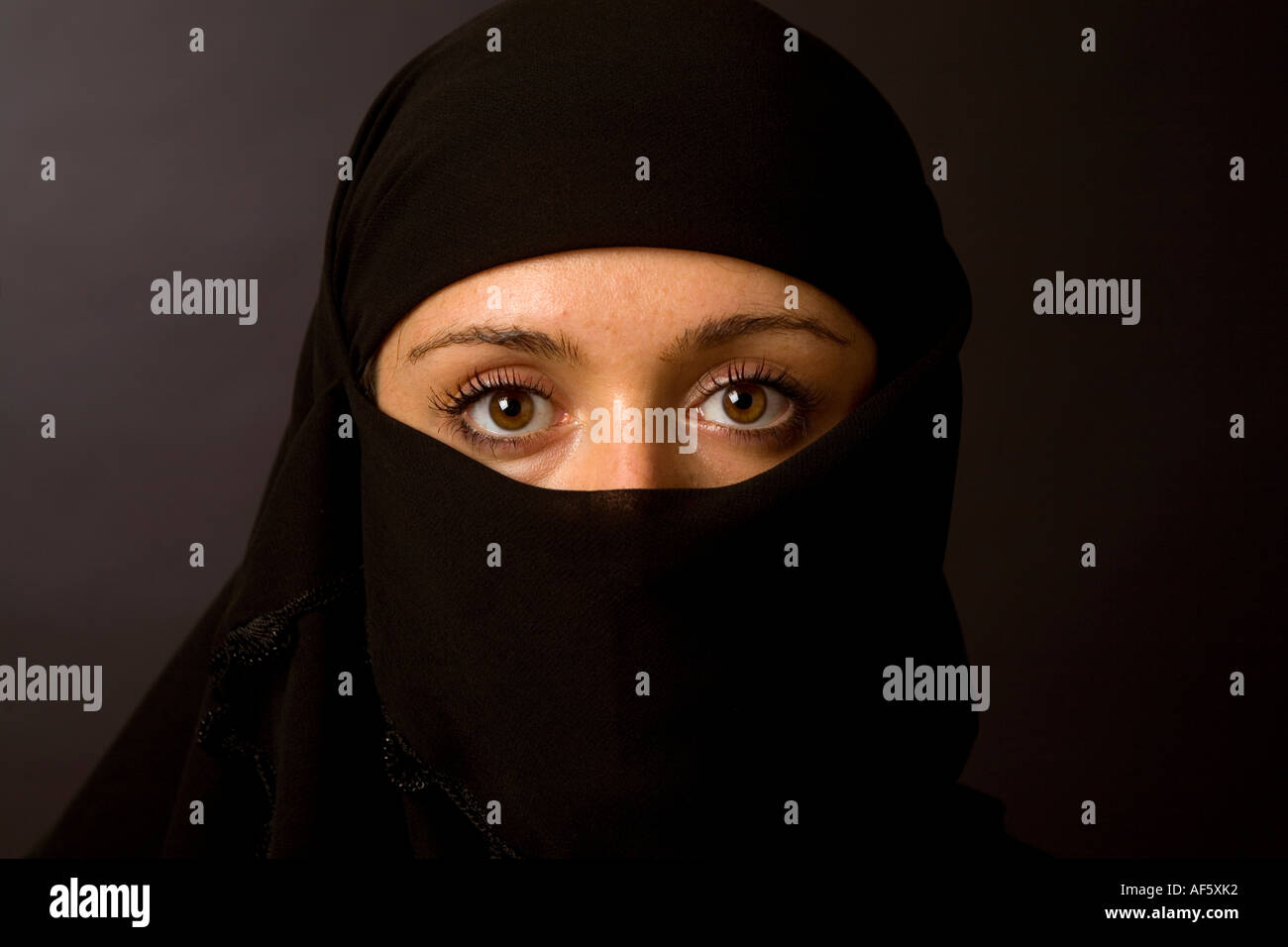 Close up head shot of a Muslim woman in a black hijab burka burqa Stock ...