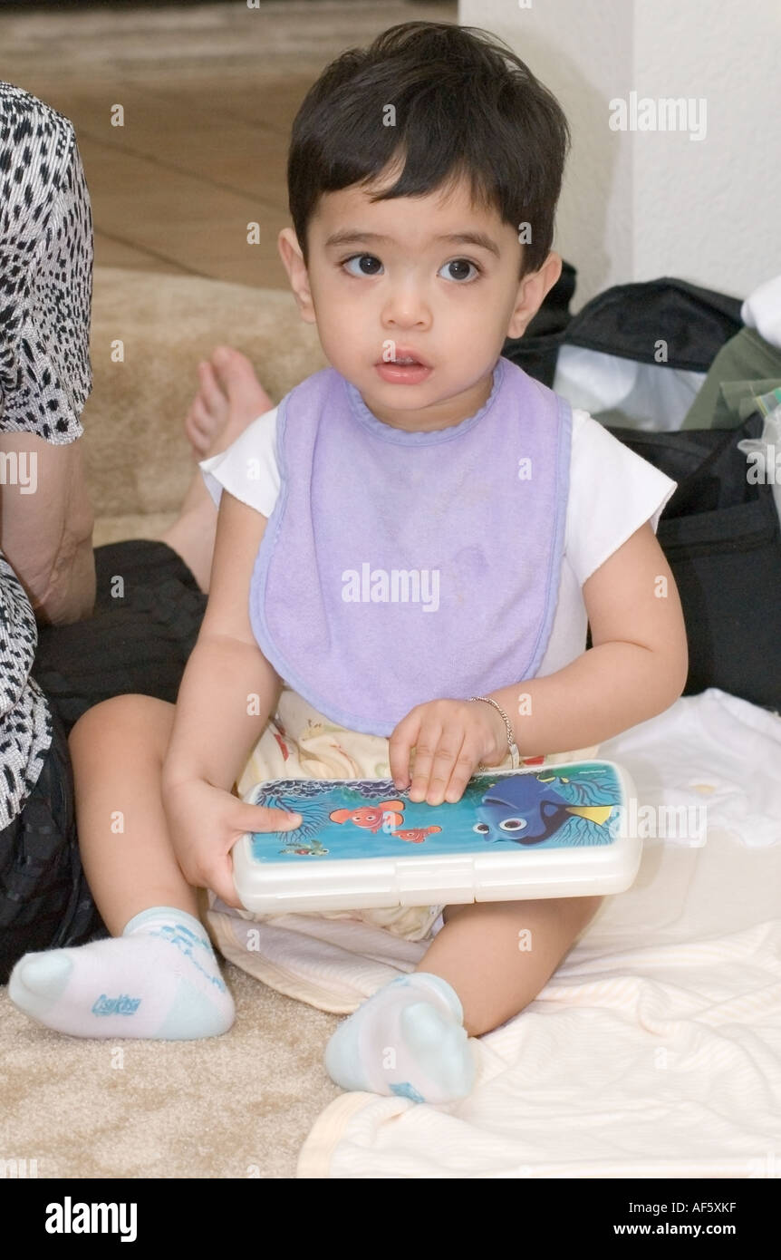 Cute baby boy with serious expression Stock Photo - Alamy
