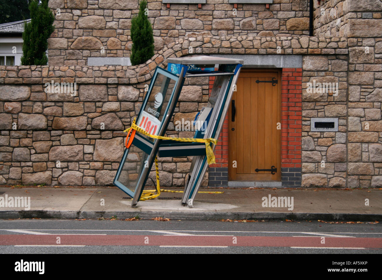 Bent telephone box Stock Photo - Alamy
